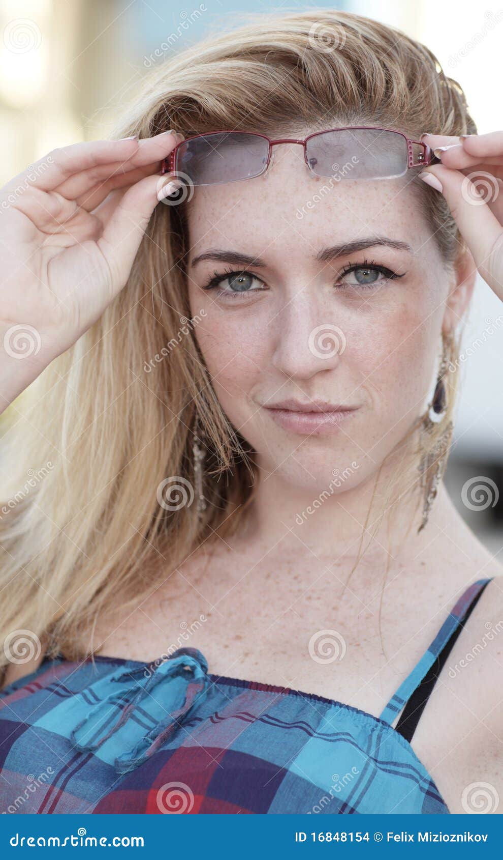 Woman removing her glasses stock photo. Image of mascara - 16848154