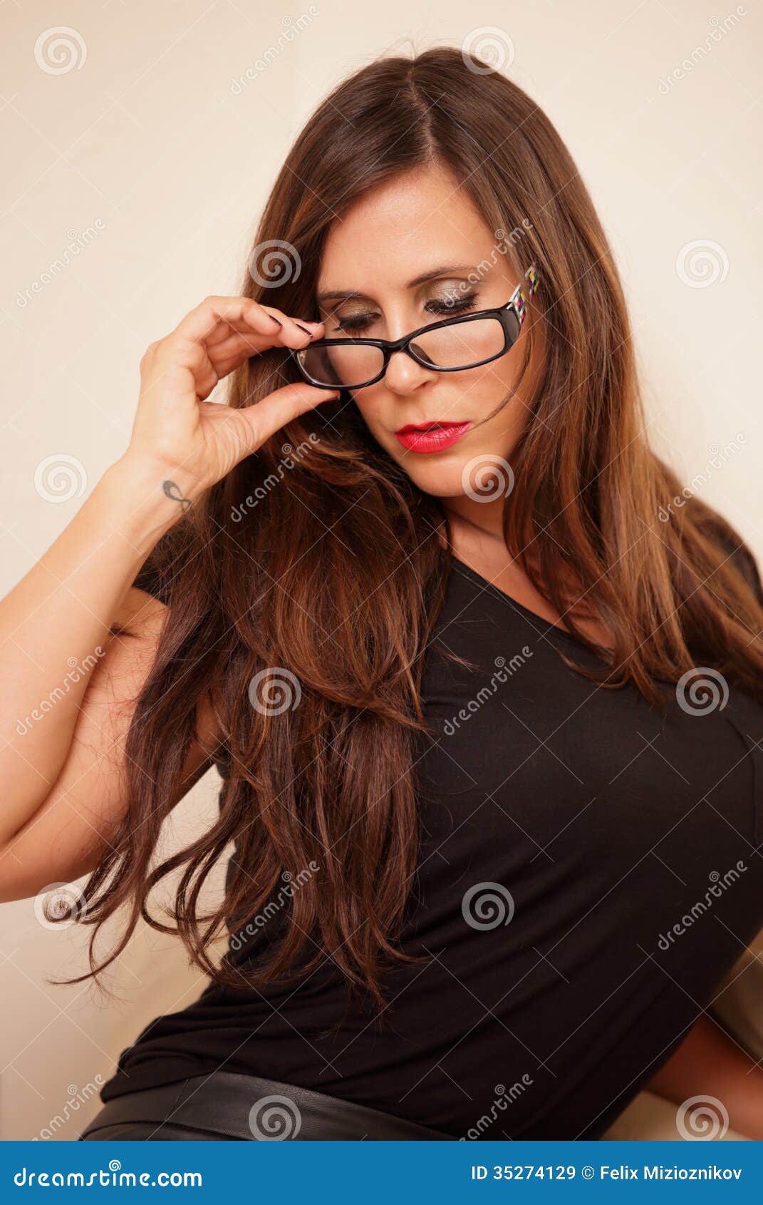 Woman removing her glasses stock image. Image of model - 35274129