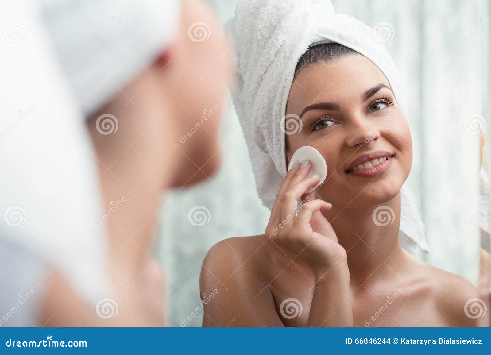 Woman removing make-up stock photo. Image of closeup - 66846244