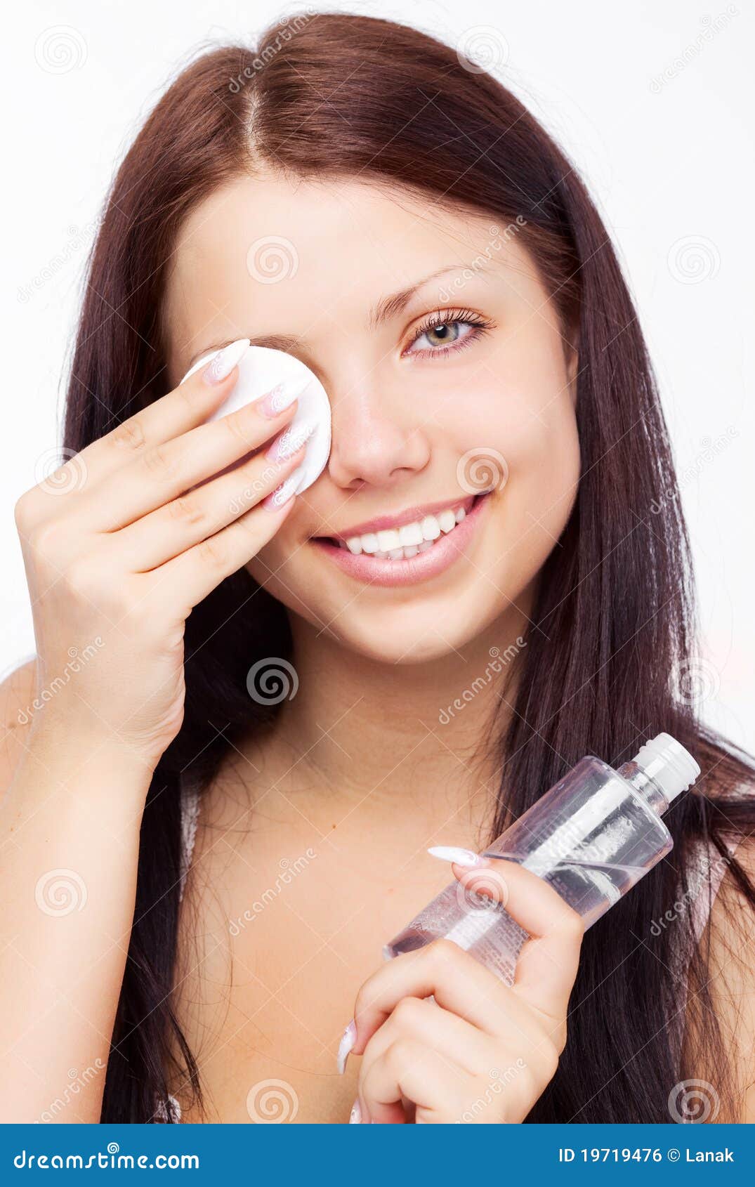 Woman removing makeup stock photo. Image of brunette - 19719476
