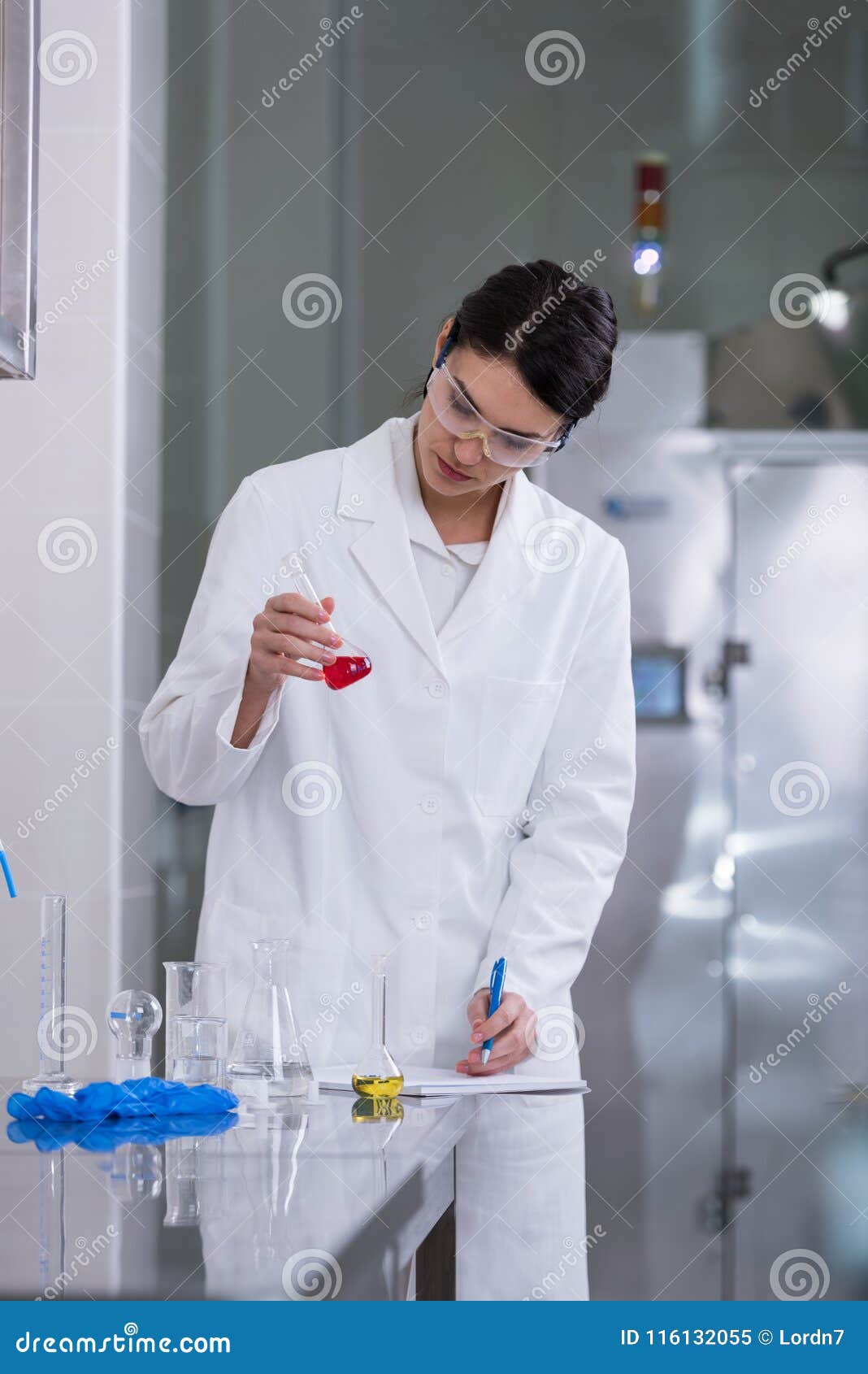 Woman Researcher Doing a Lab Test and Making Notes Stock Image - Image ...