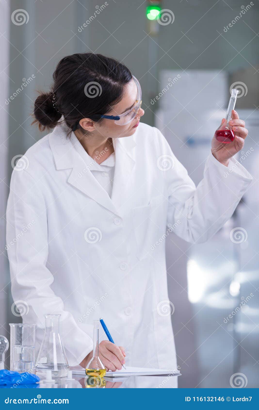 Woman Researcher Doing a Lab Test and Making Notes Stock Photo - Image ...