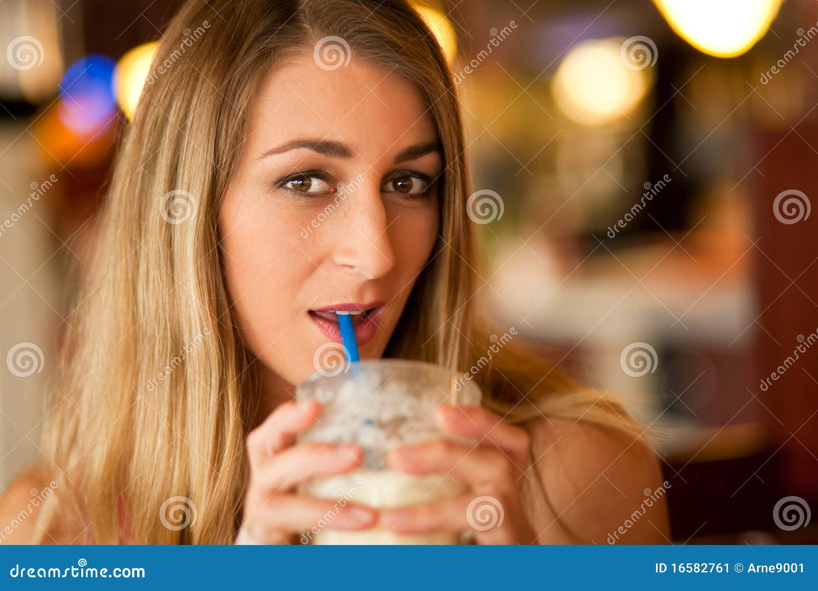 Woman in Restaurant Drinking Milkshake Stock Image - Image of smile ...
