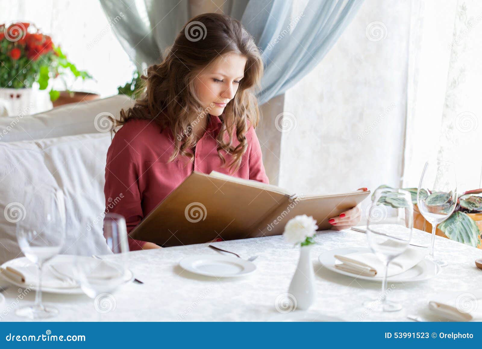 A Woman in a Restaurant with the Menu in Hands Stock Image - Image of ...