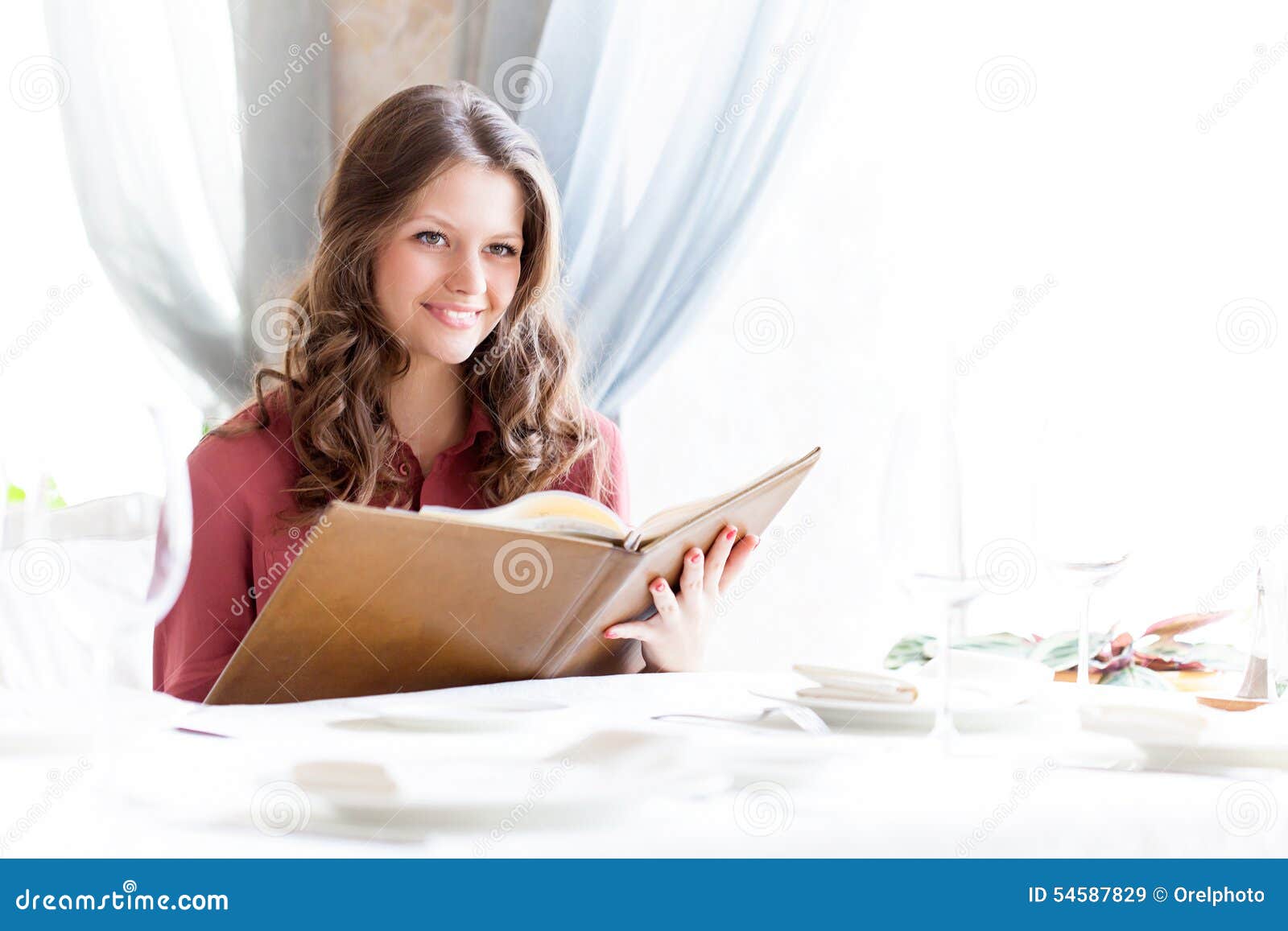 A Woman in a Restaurant with the Menu in Hands Stock Image - Image of ...
