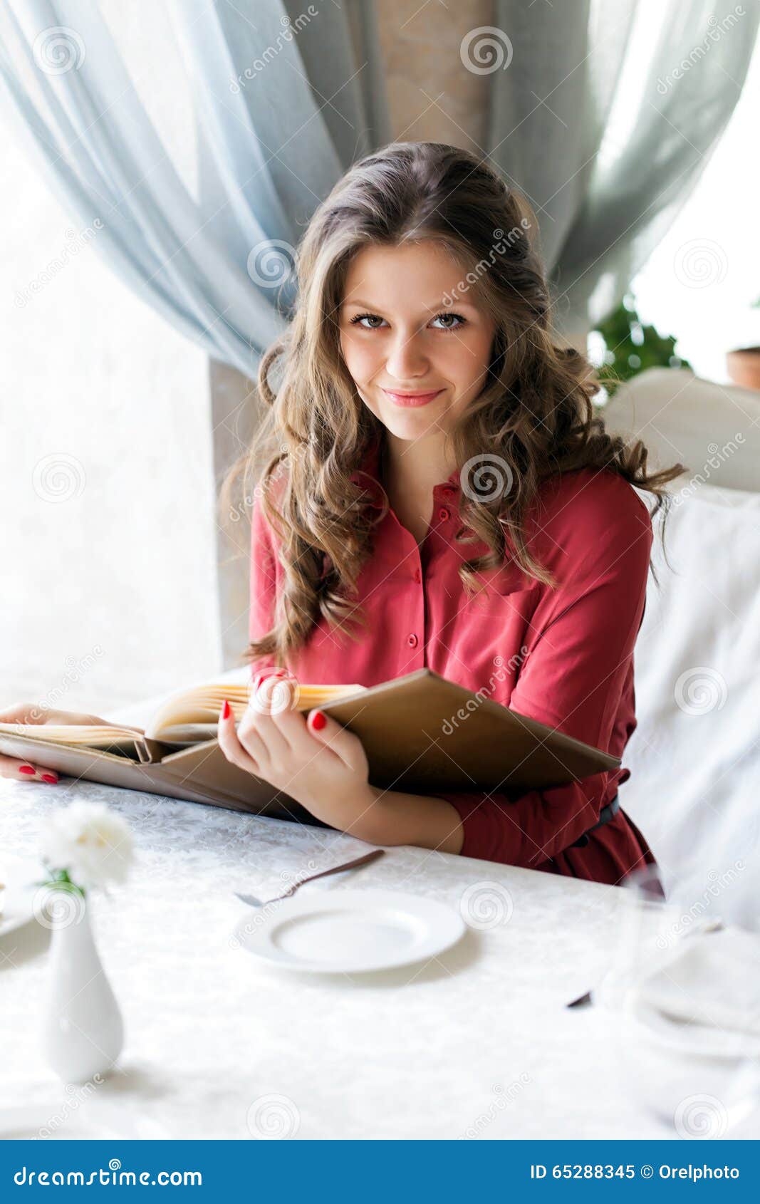 A Woman in a Restaurant with the Menu in Hands Stock Image - Image of ...
