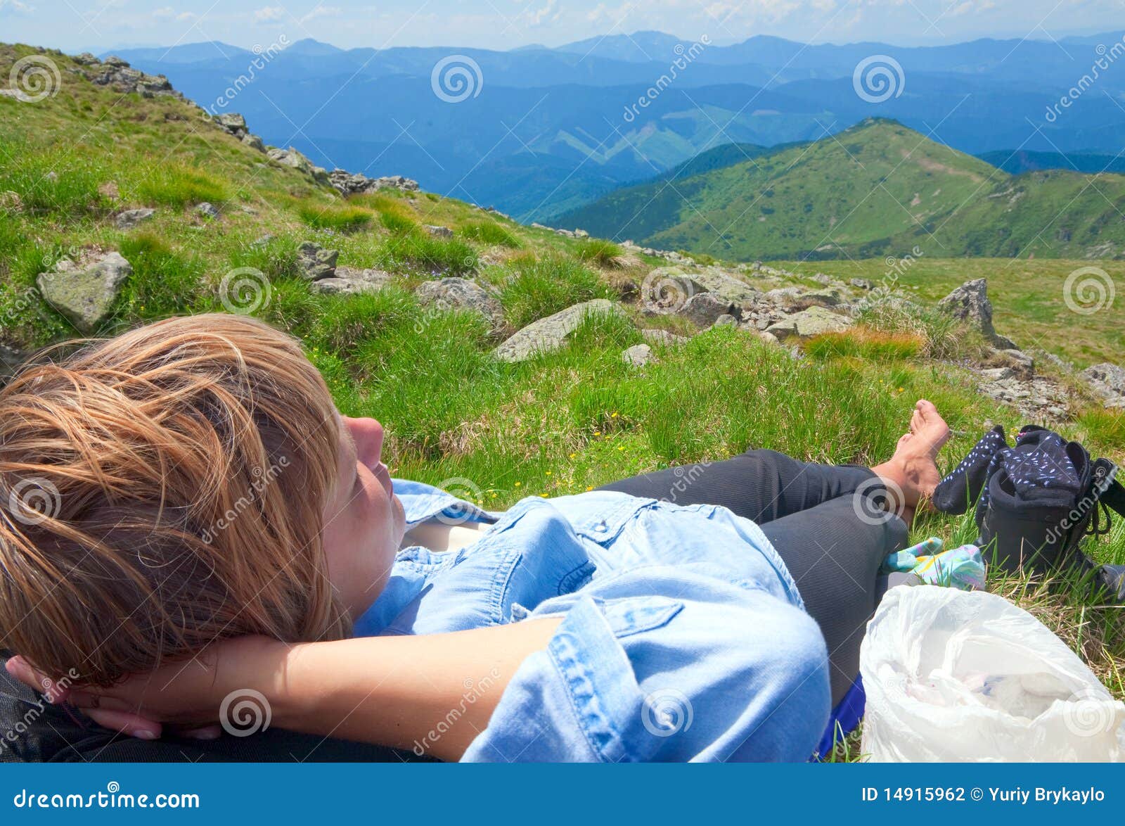 Woman Resting on a Mountain Top Stock Photo - Image of lying ...