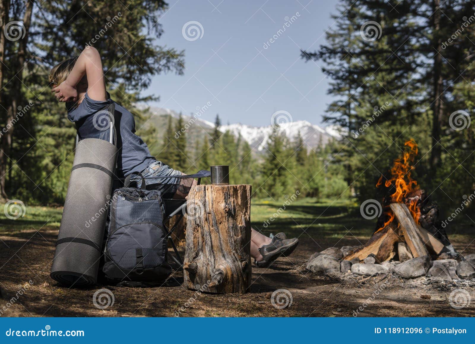 Woman Resting Near the Campfire. Rear View. Stock Photo - Image of ...