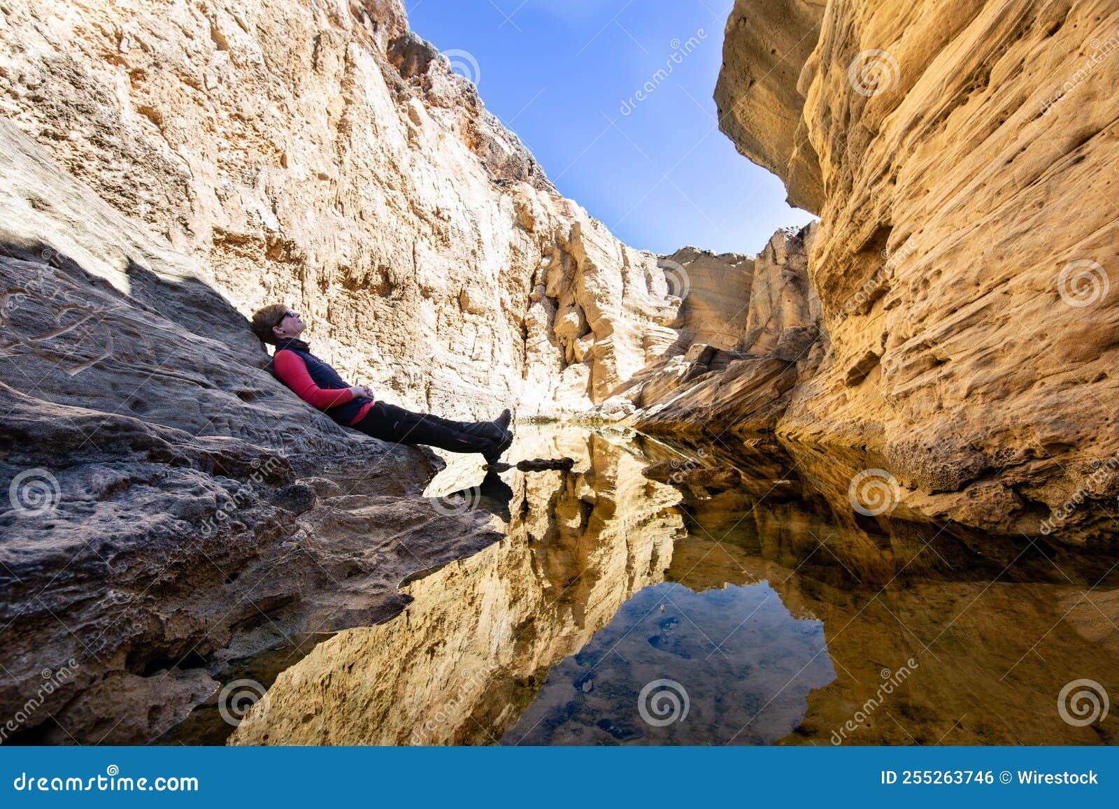 Woman Resting on a Rock in the Gorge. Stock Photo - Image of hiking ...