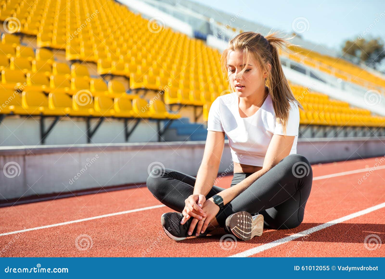 Woman resting at stadium stock image. Image of strength - 61012055
