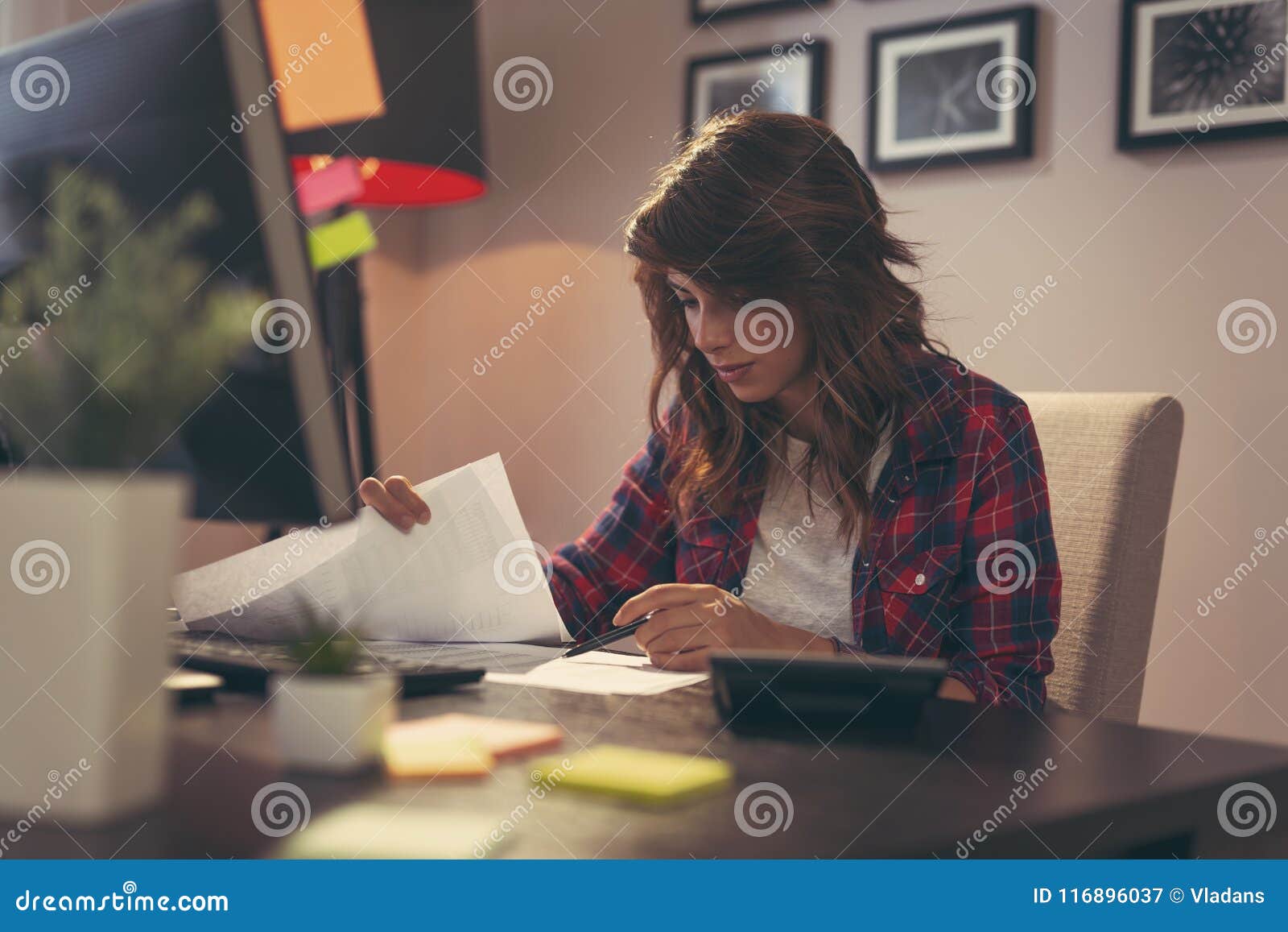 Woman Reviewing Documents in Home Office Stock Image - Image of ...
