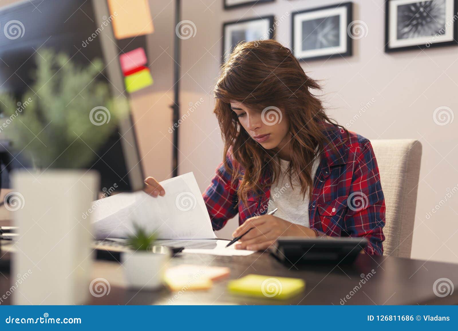 Woman Reviewing Documents in a Home Office Stock Photo - Image of ...