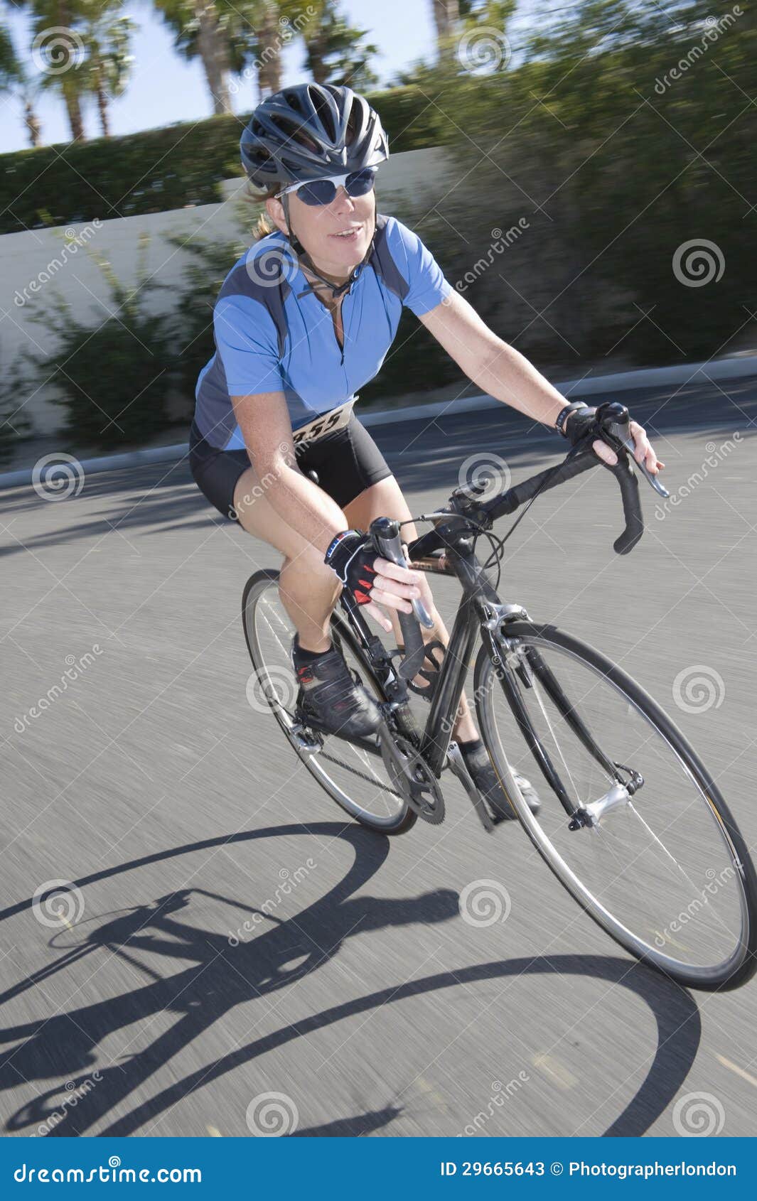 Woman Riding Bicycle stock image. Image of exercising - 29665643