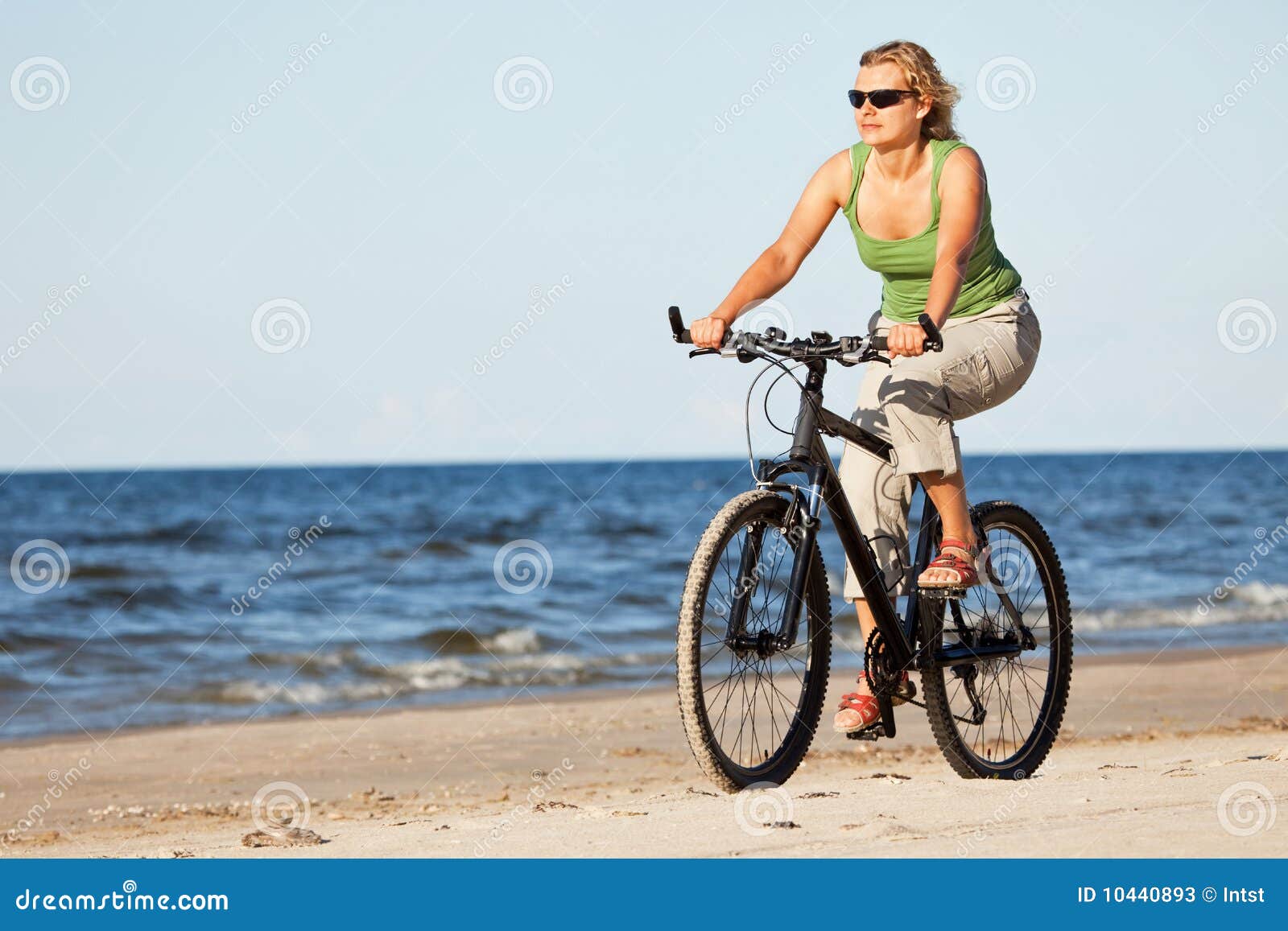Woman Riding Bicycle in Beach Stock Image - Image of action, bicycle ...