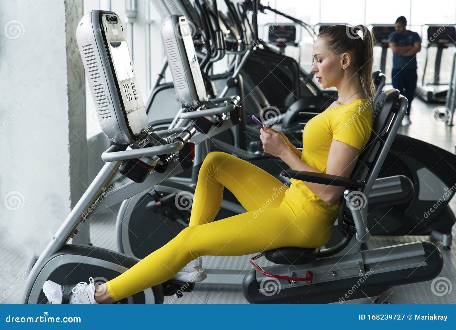 Woman Riding Horizontal Exercise Bike in Gym Stock Image - Image of ...