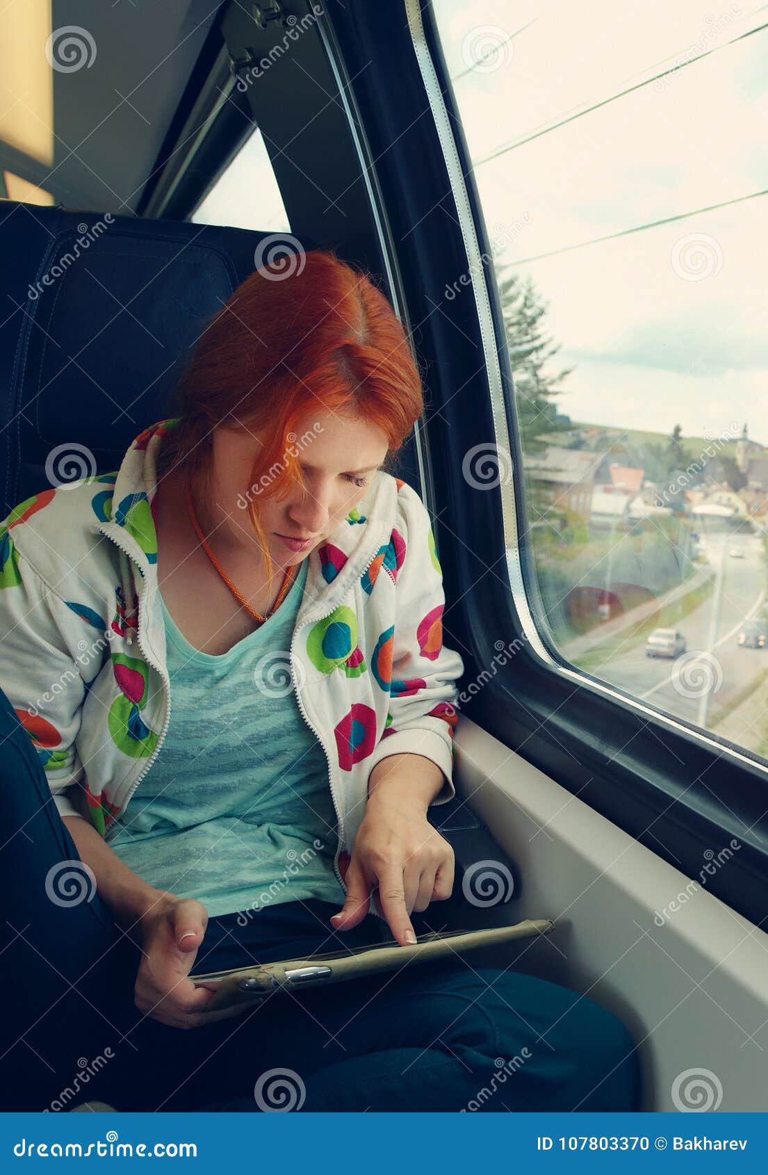 Woman riding on a train stock photo. Image of tablet - 107803370