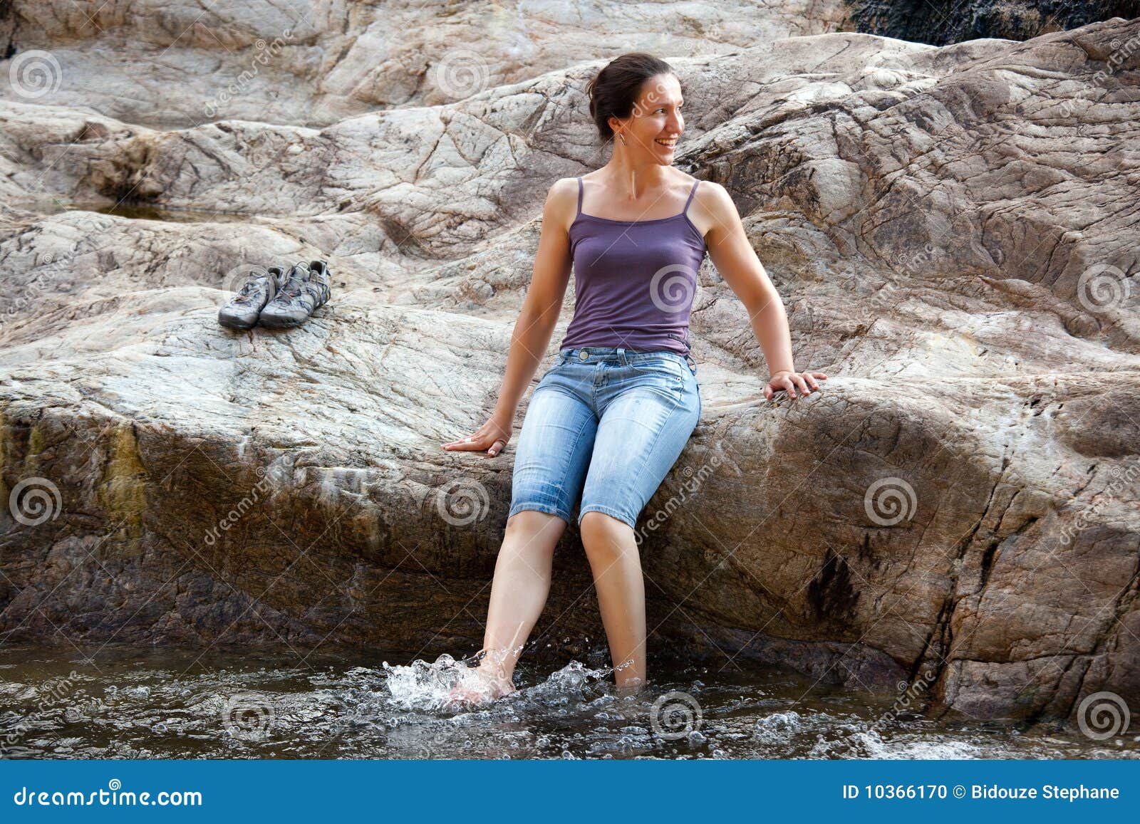 Woman on riverbank stock photo. Image of shore, seated - 10366170