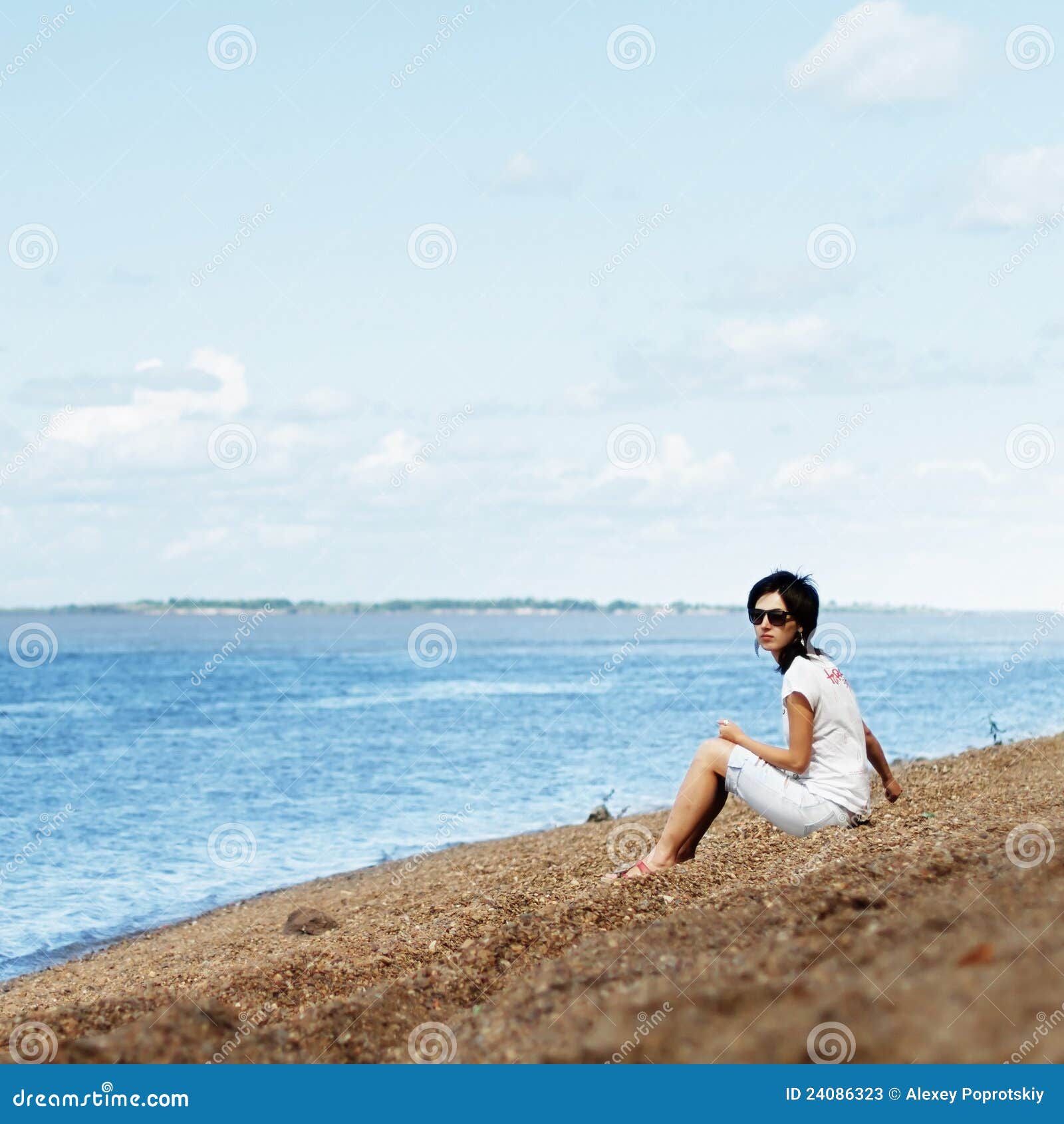 Woman on the riverbank stock image. Image of river, sitting - 24086323