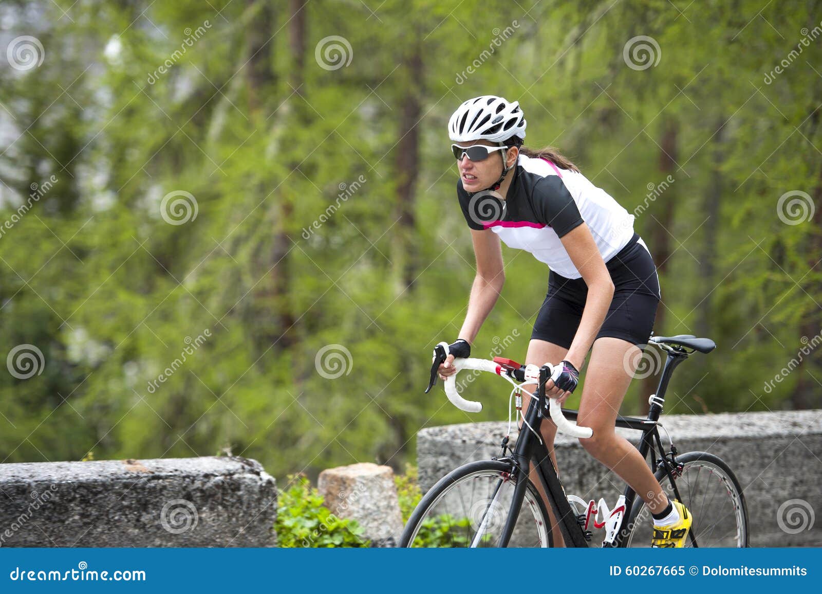 Woman road cycling uphill stock image. Image of movement - 60267665