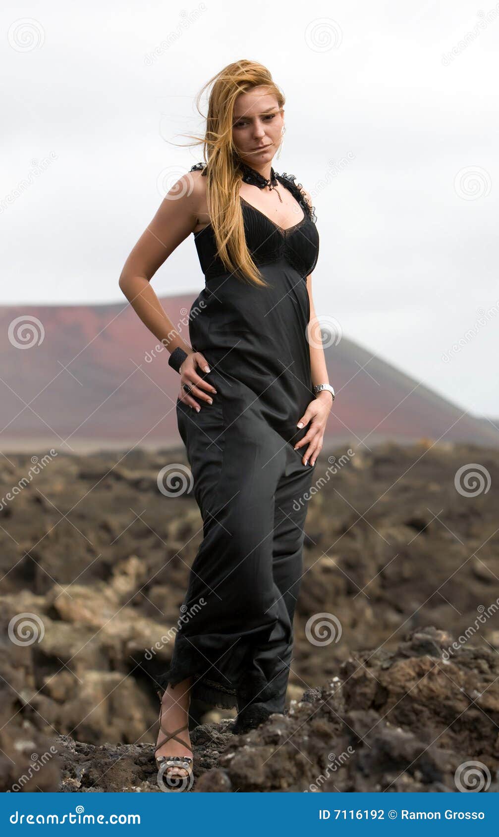 Woman on a rock stock photo. Image of volcano, clouds - 7116192