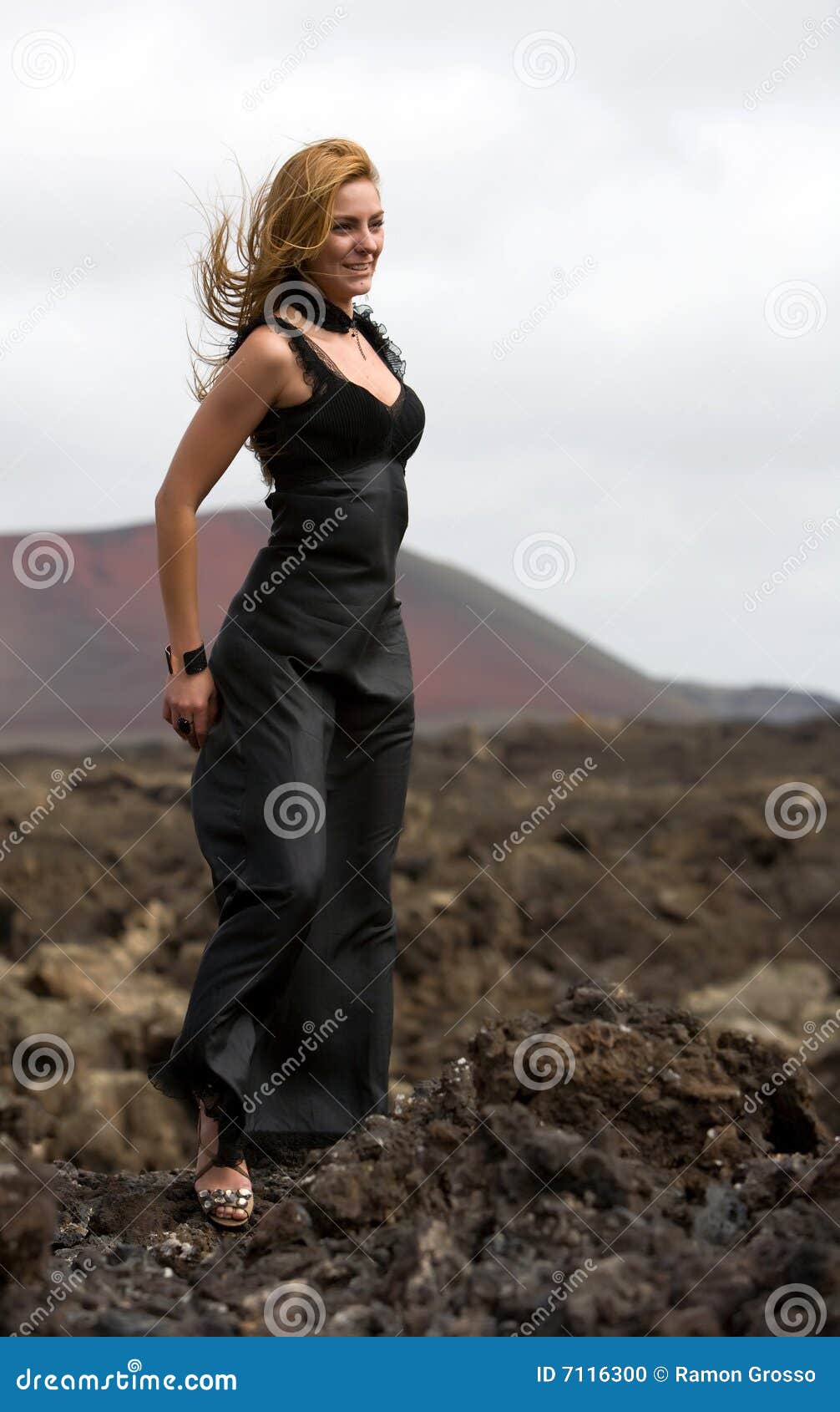 Woman on a rock stock photo. Image of dress, volcano, serene - 7116300