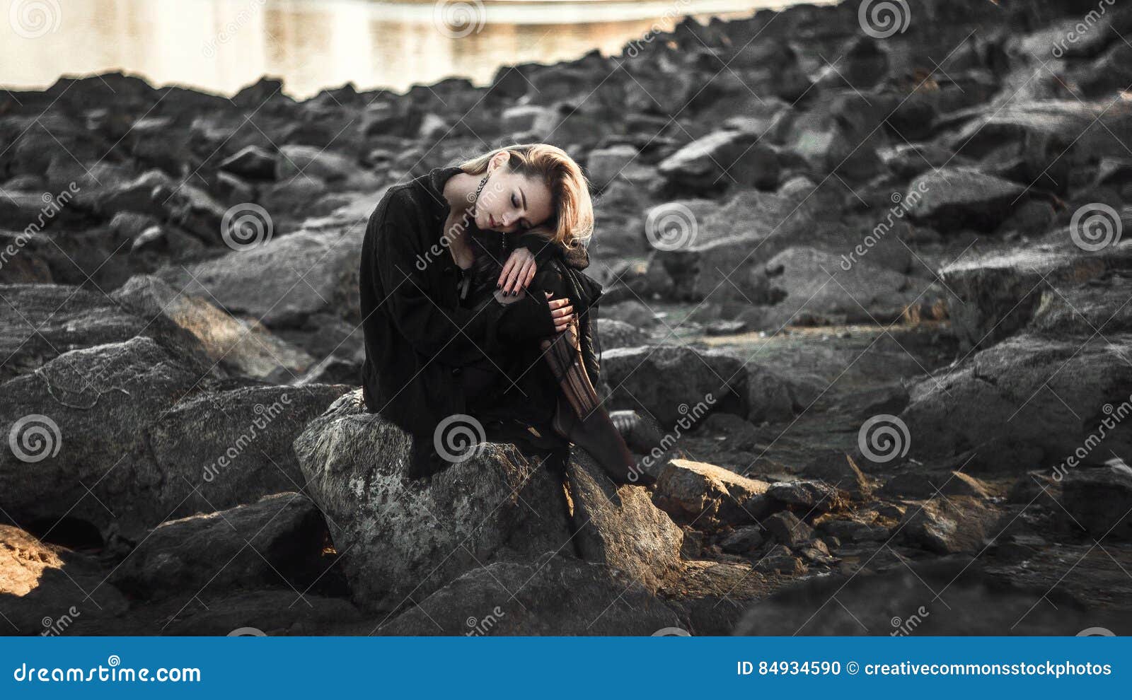 Woman On Rocks Picture. Image: 84934590