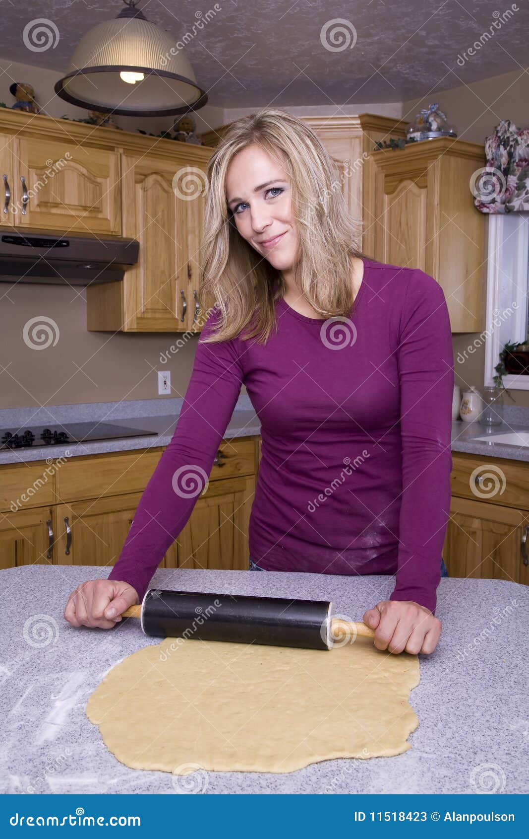 Woman rolling dough stock image. Image of assistance - 11518423
