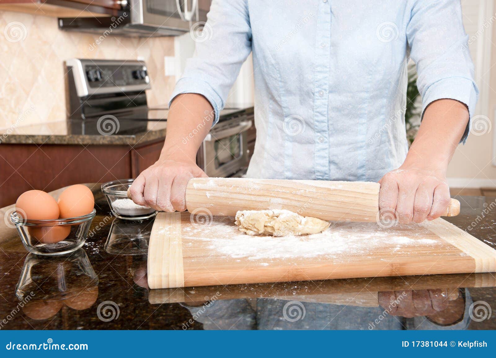 Woman Rolling Dough stock photo. Image of arms, baking - 17381044