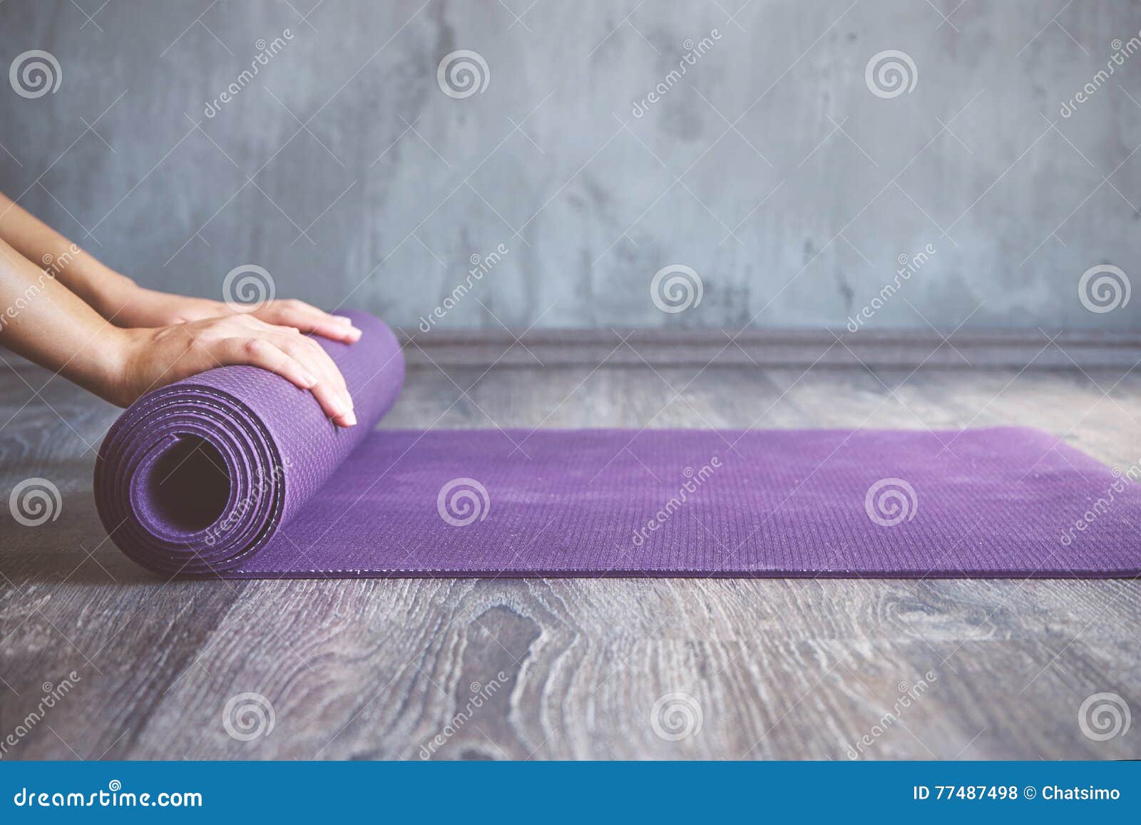 Woman Rolling Her Mat after a Yoga Class Stock Photo - Image of ...