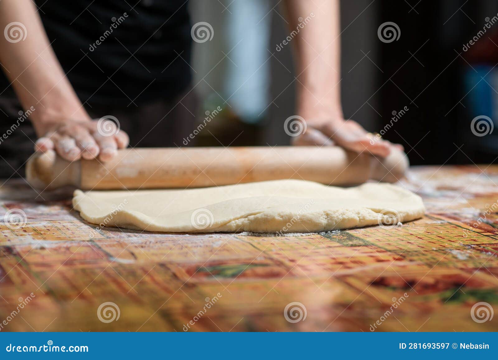 Woman Rolls Out Dough with Rolling Pin. Preparation of Dough for ...