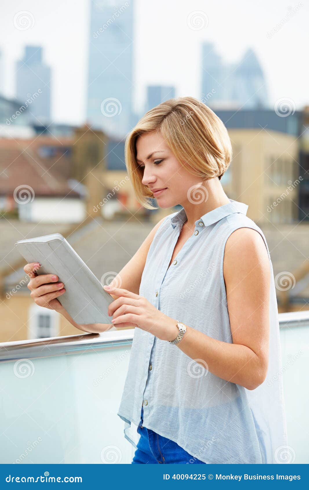 Woman on Roof Terrace Using Digital Tablet Stock Image - Image of ...