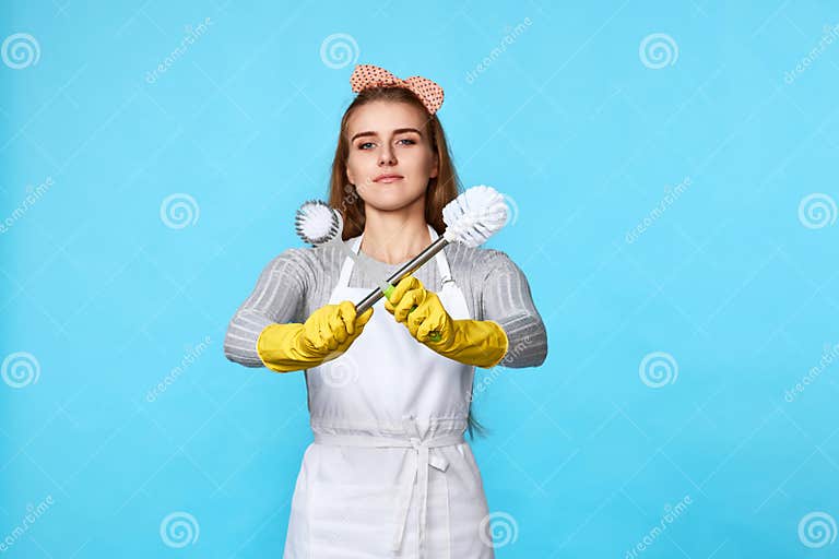 Woman In Rubber Gloves And Cleaner Apron Cleaning With Sponge Stock