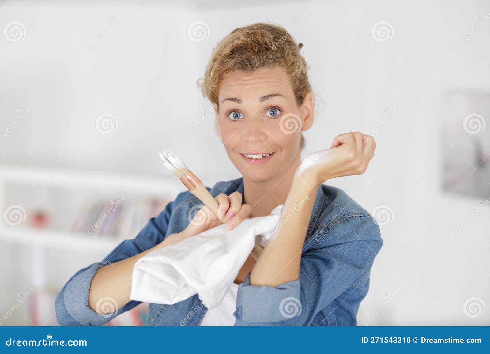 Woman Rubbing Paint Off Arm after Decorating Stock Photo - Image of ...