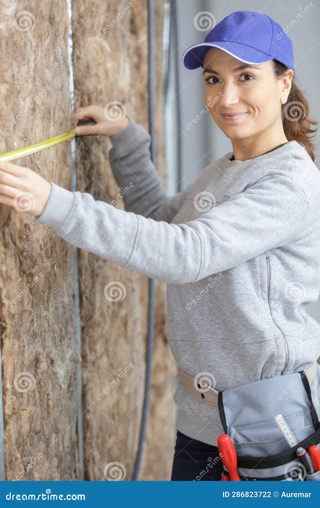 Woman with Ruler Measuring Wall Lenght Stock Photo - Image of ruler ...