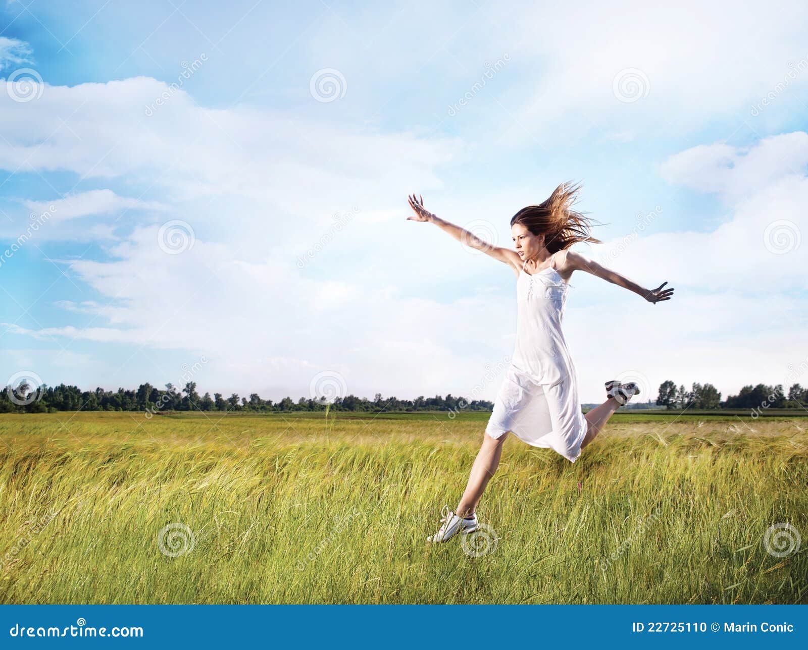 Woman running across field stock photo. Image of sunny - 22725110