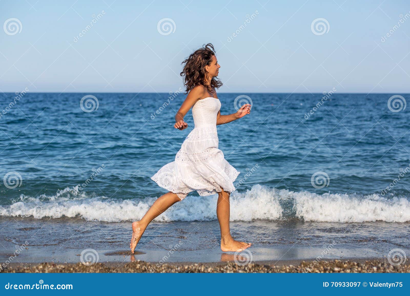 Woman Running Along a Beach. Stock Image - Image of sunny, active: 70933097