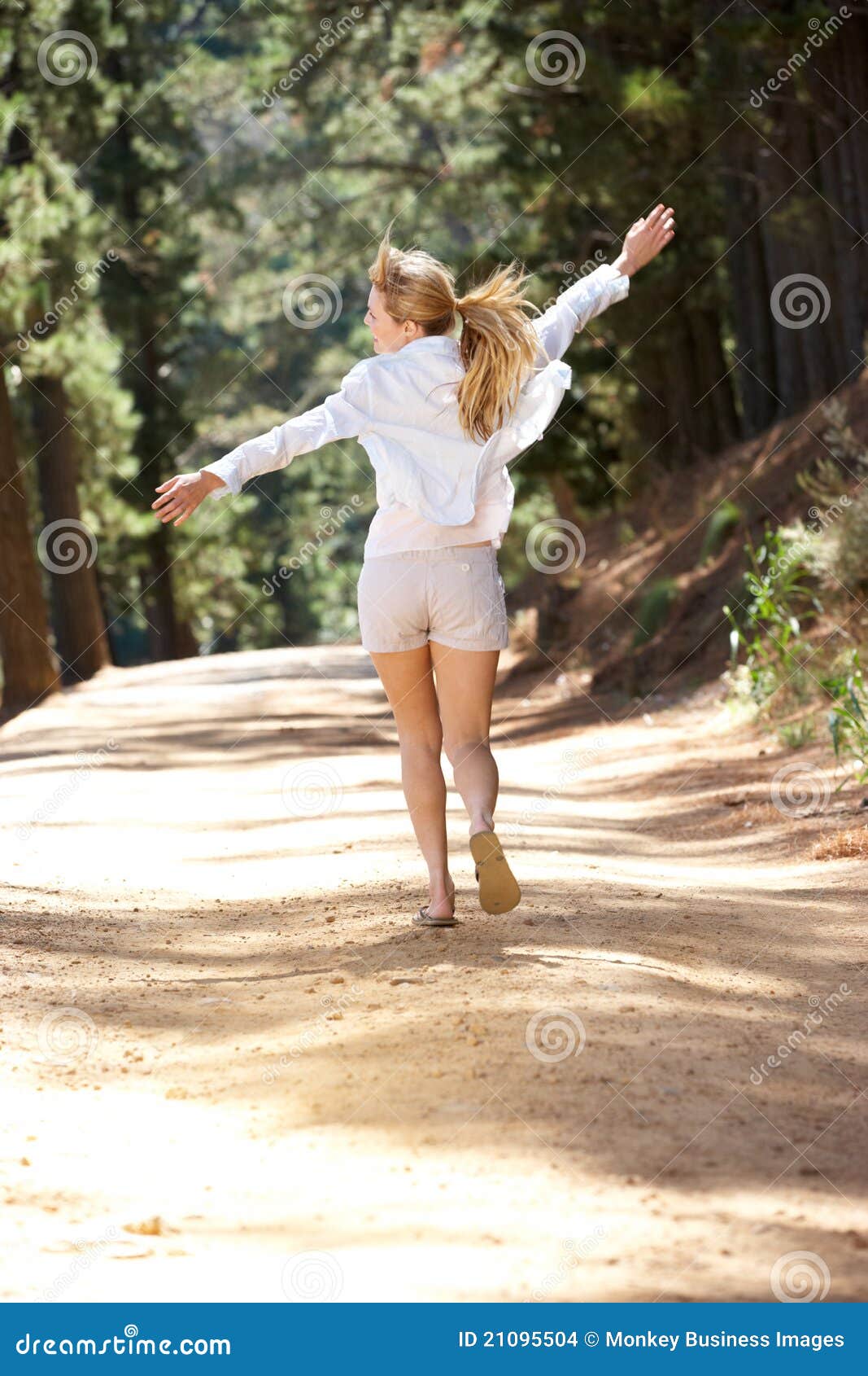 Woman Running Down Country Lane Stock Photo - Image of energy, carefree ...