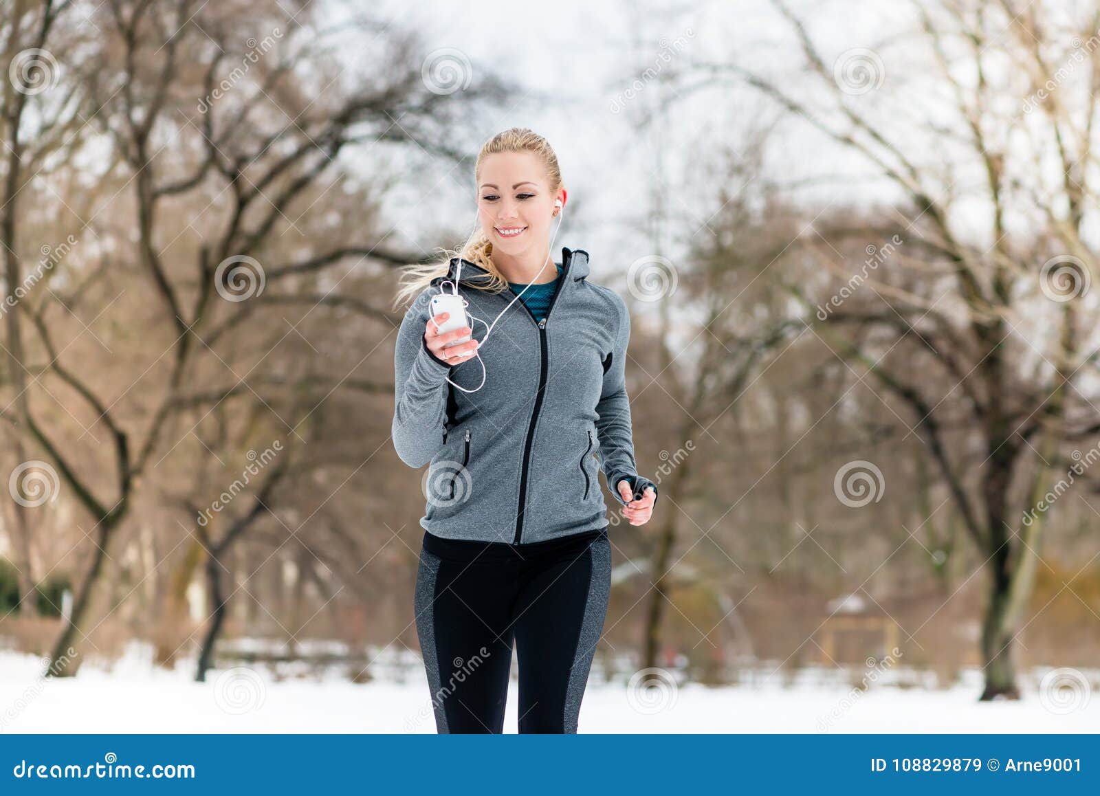 Woman Running Down a Path on Winter Day in Park Stock Image - Image of ...