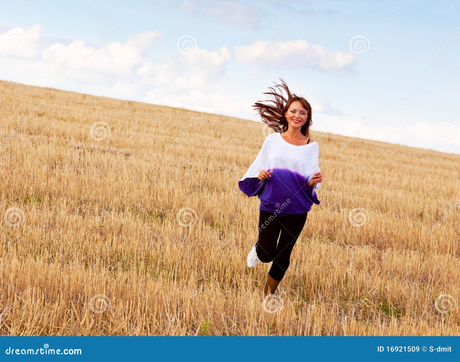 A Woman is Running through the Field Stock Image - Image of field ...