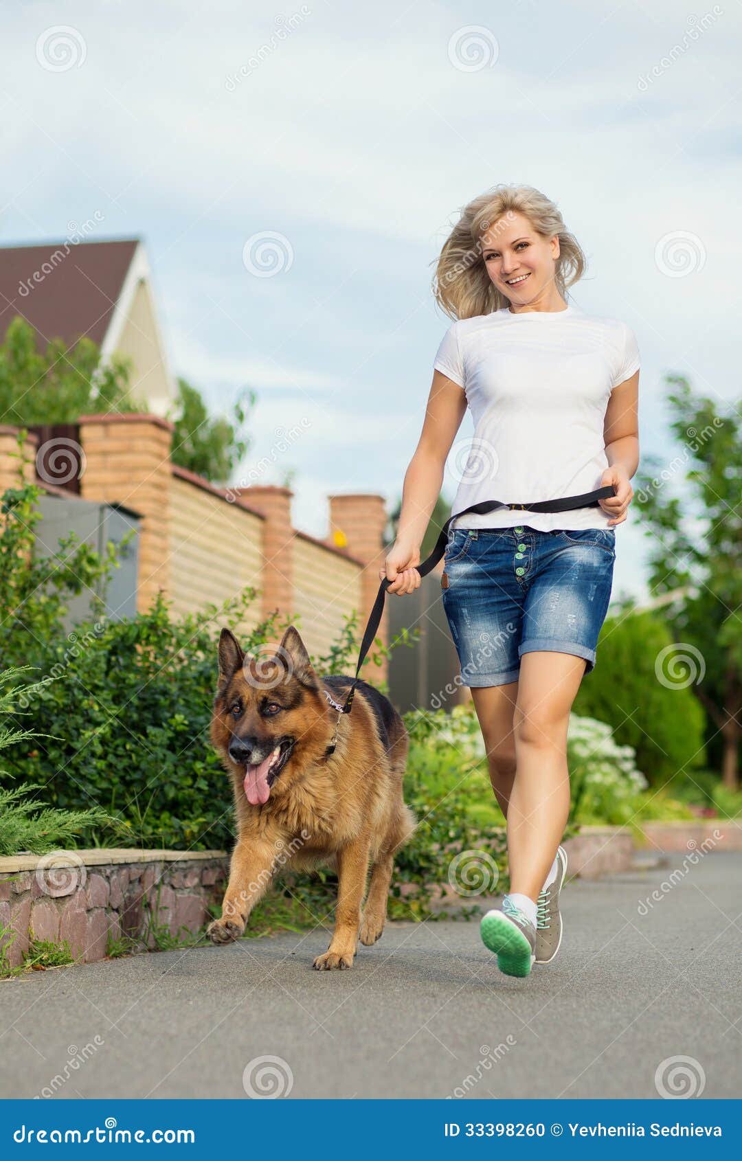 Woman running with her dog stock photo. Image of healthy - 33398260
