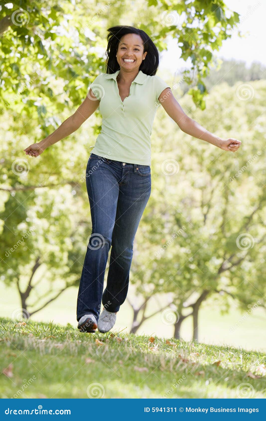 Woman Running Outdoors Smiling Stock Image - Image of young ...