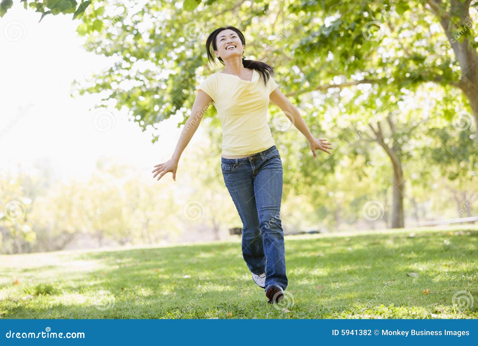 Woman Running Outdoors Smiling Stock Photo - Image of escape, outside ...