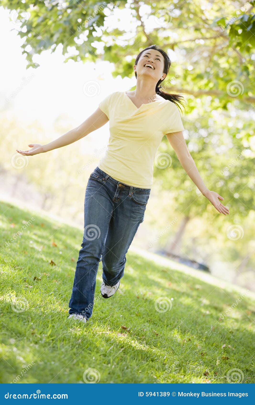 Woman Running Outdoors Smiling Stock Image - Image of women, enjoying ...