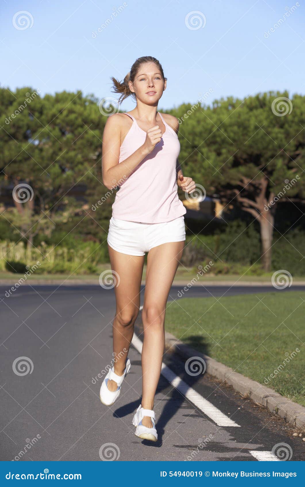 Woman Running on Road stock image. Image of running, outside - 54940019