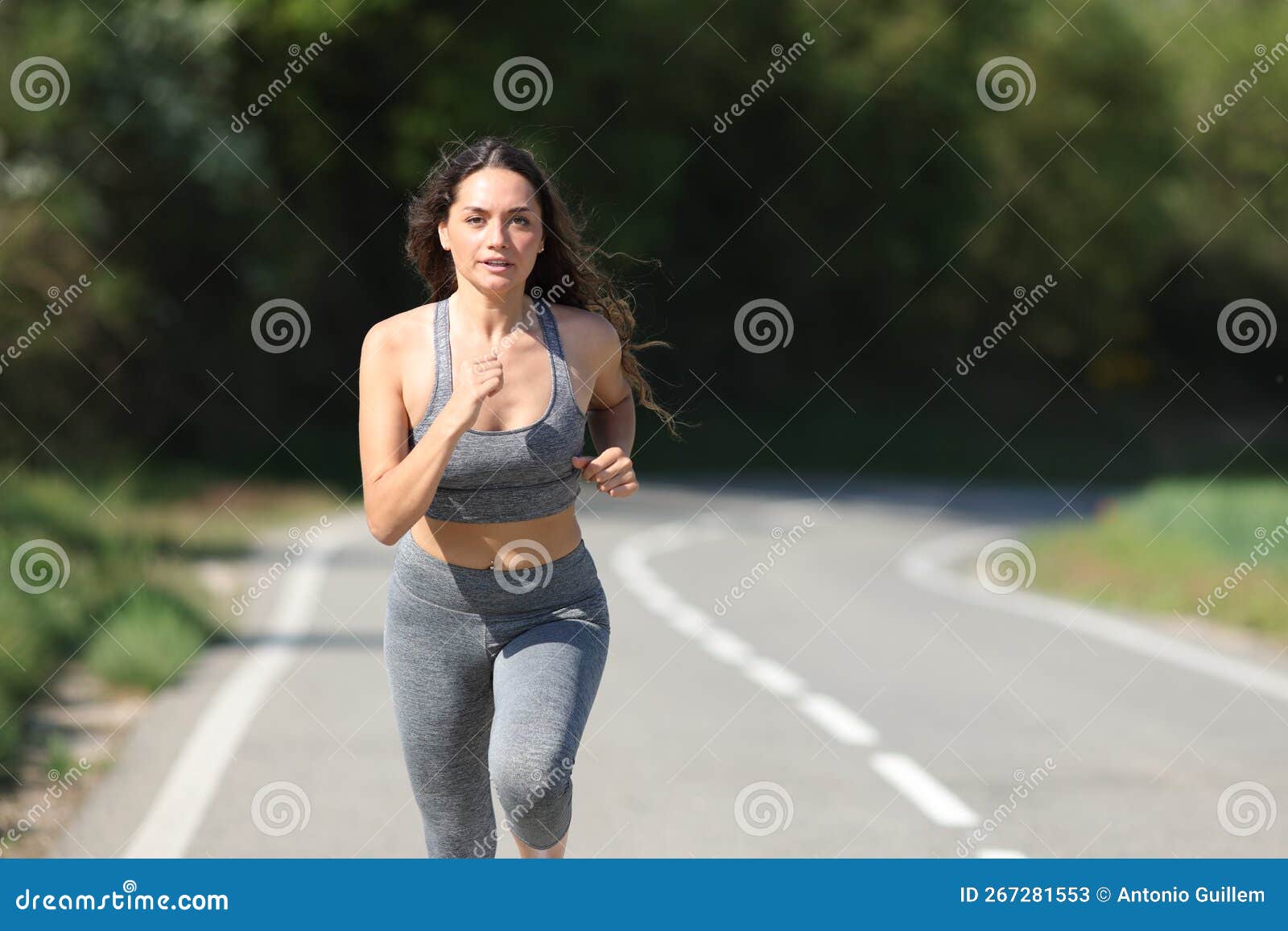 Woman running in a road stock image. Image of endurance - 267281553
