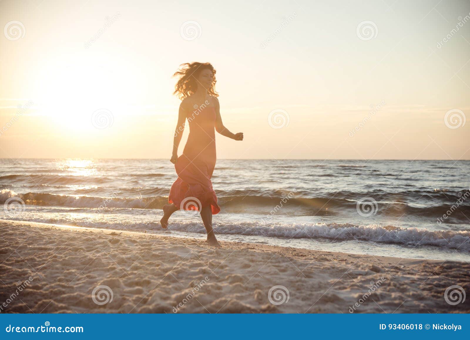Woman running on the sea stock photo. Image of fashion - 93406018