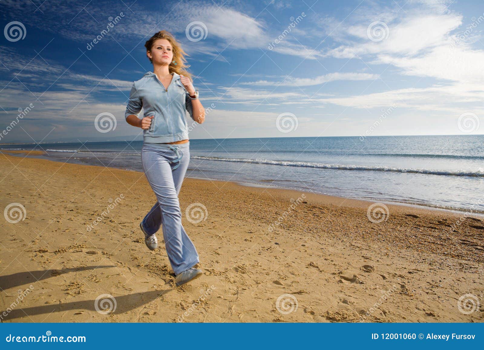 Woman running at sea shore stock photo. Image of woman - 12001060