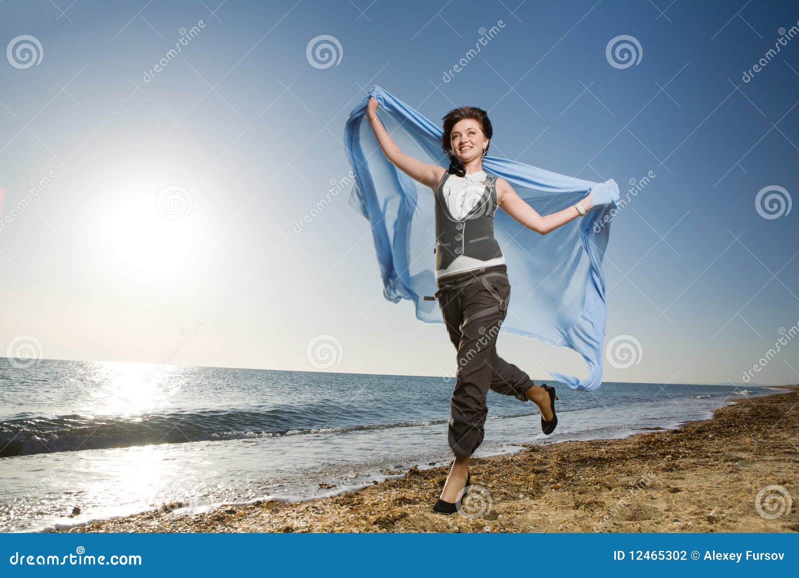 Woman running at sea shore stock photo. Image of beauty - 12465302