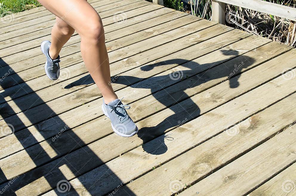 Woman Running Shadow stock image. Image of athlete, woman - 25013881