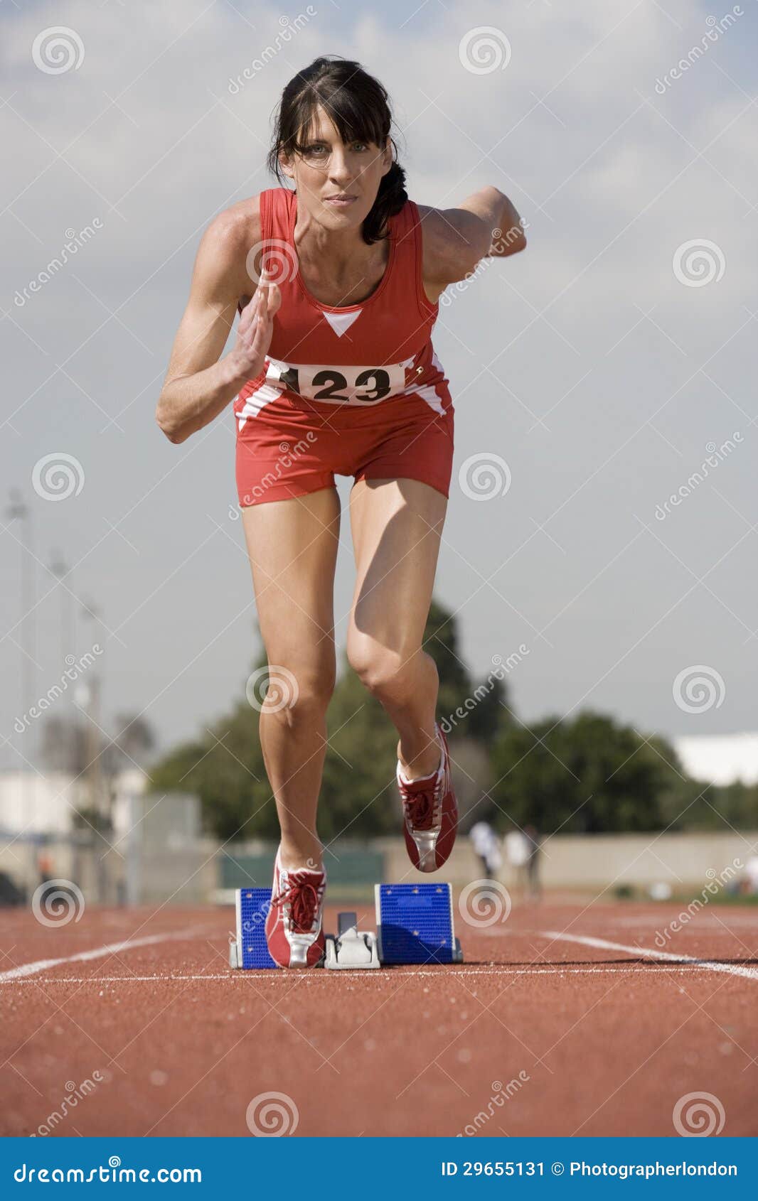 Woman Running from Starting Blocks Stock Image - Image of event ...
